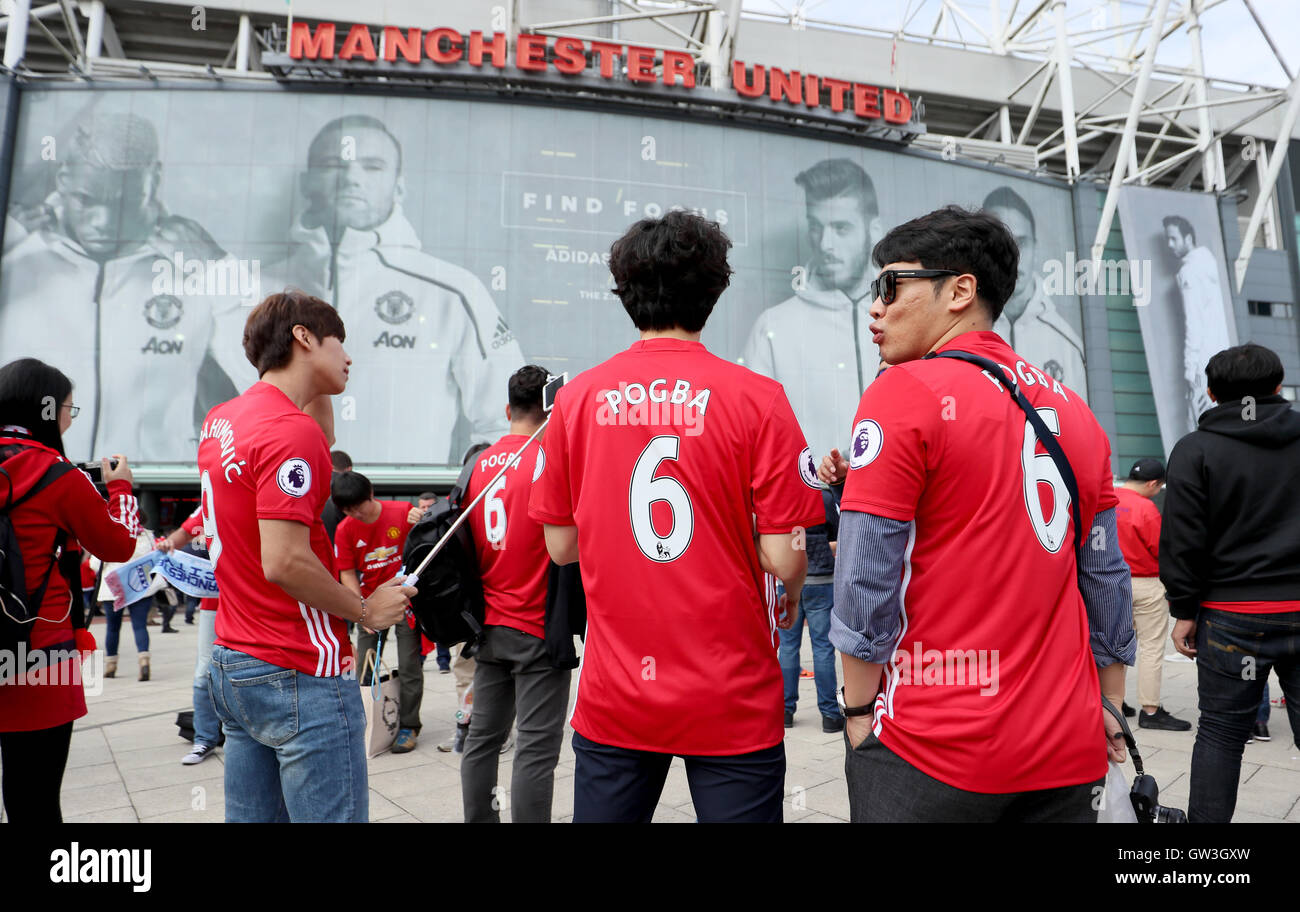 Manchester United fans stand outside Old Trafford before the Premier ...