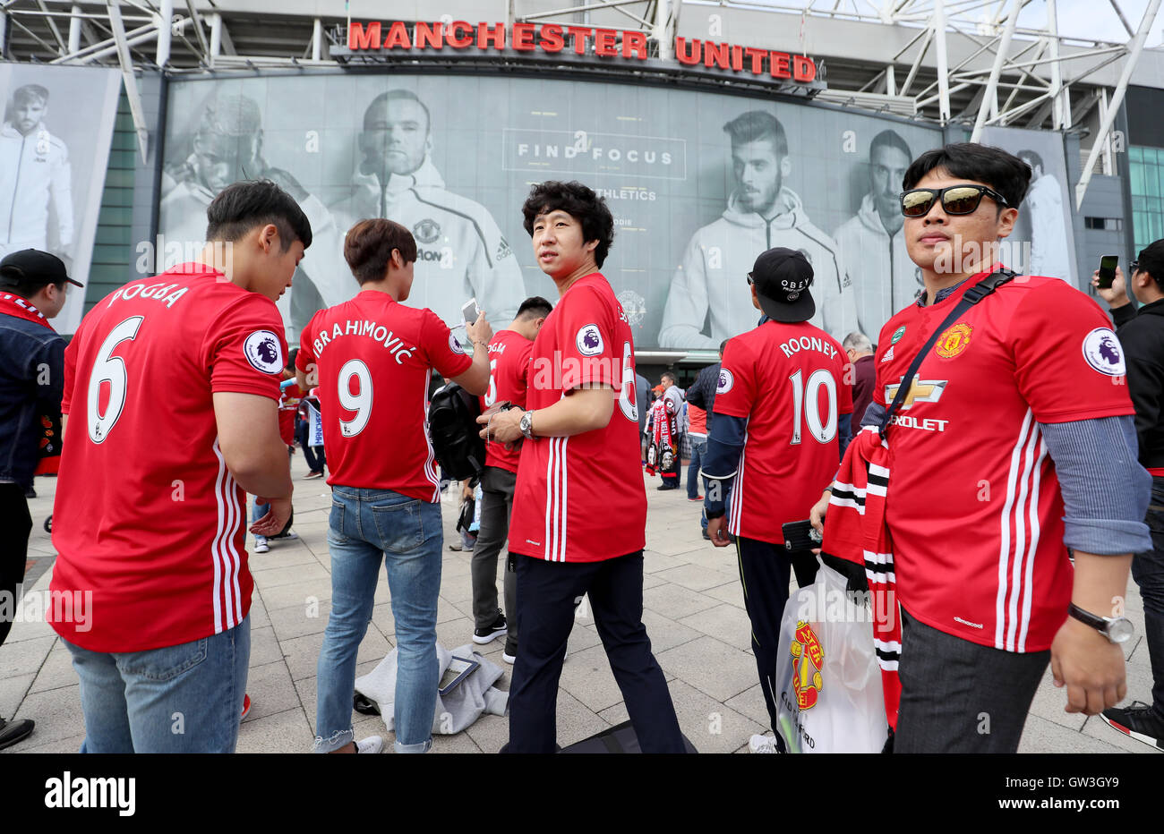 Manchester United fans stand outside Old Trafford before the Premier ...