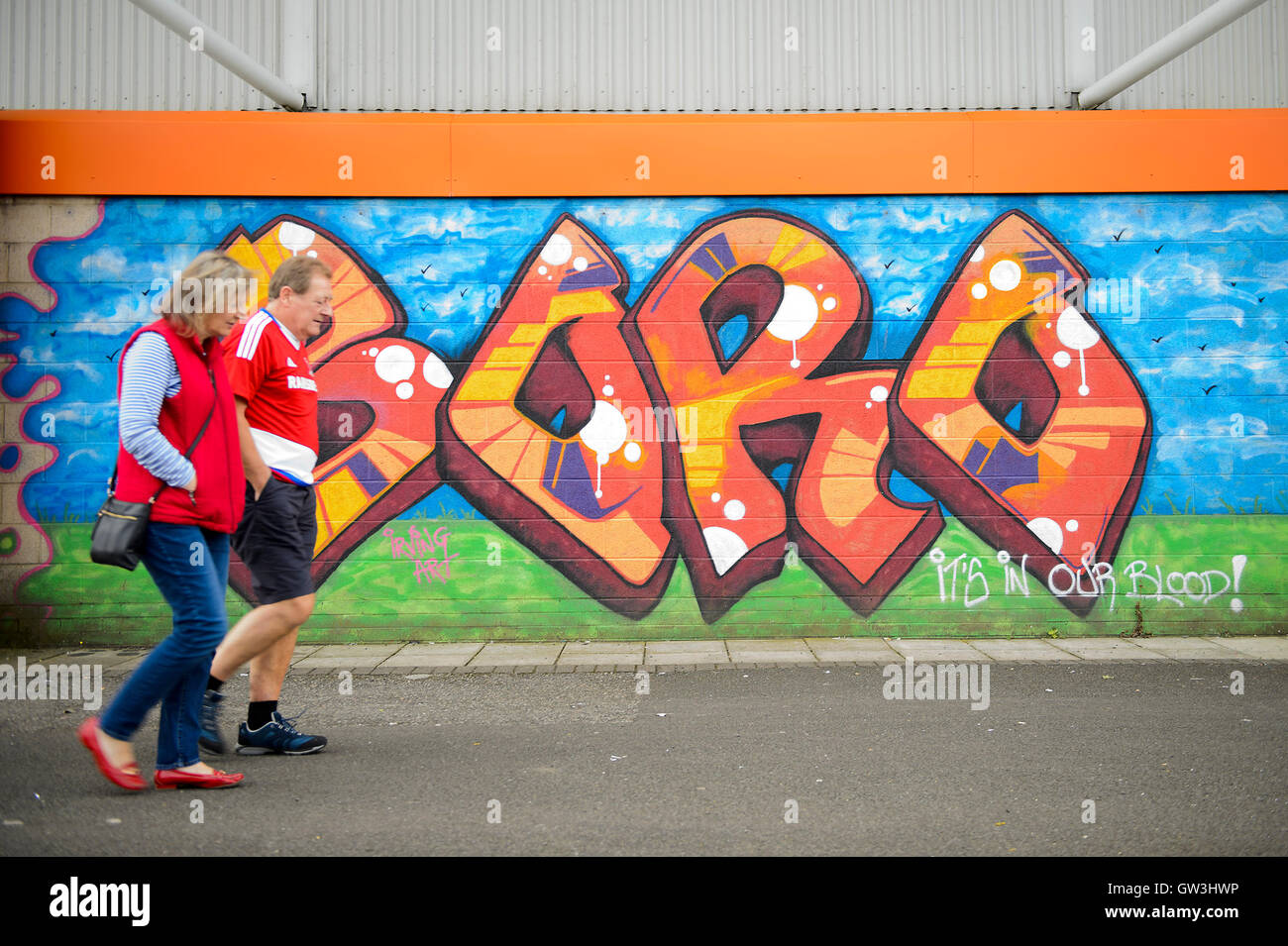 Fans walk past graffiti outside the Riverside Stadium, Middlesbrough ...
