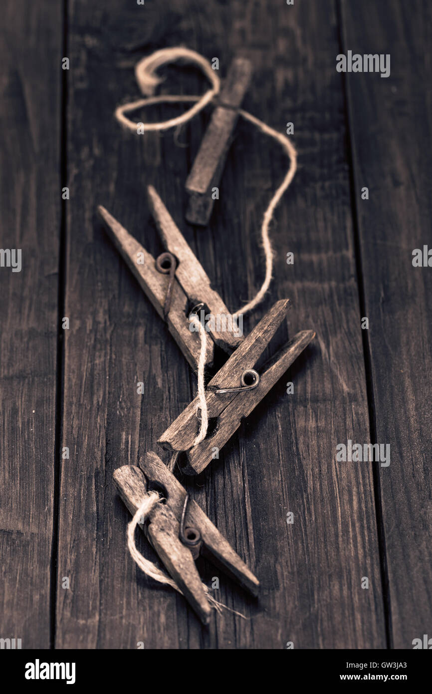 Old wooden pegs on wooden table Stock Photo - Alamy