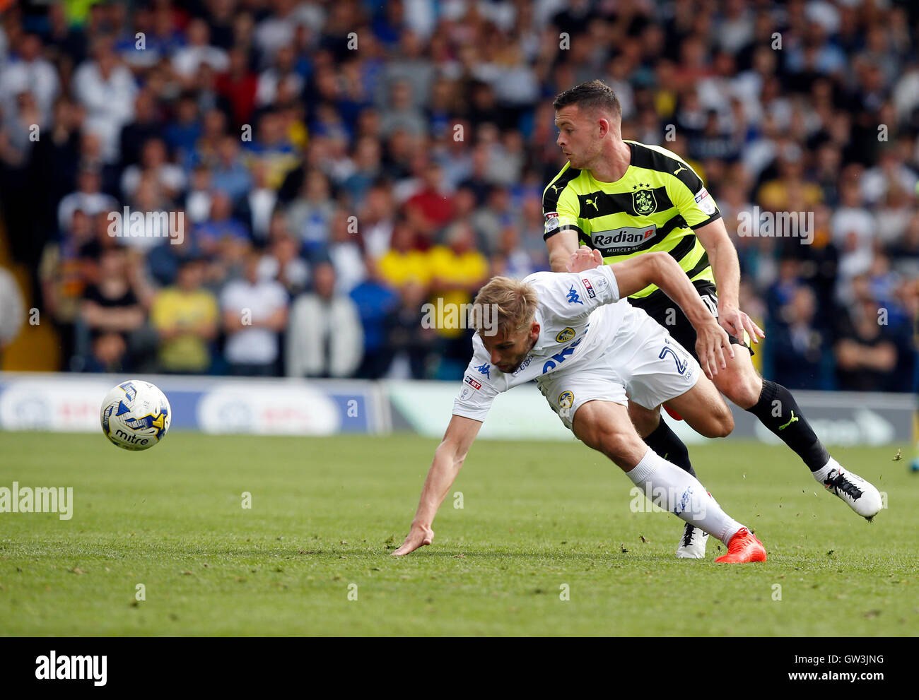 Leeds United's Charlie Taylor and Huddersfield Town's Harry Bunn battle ...