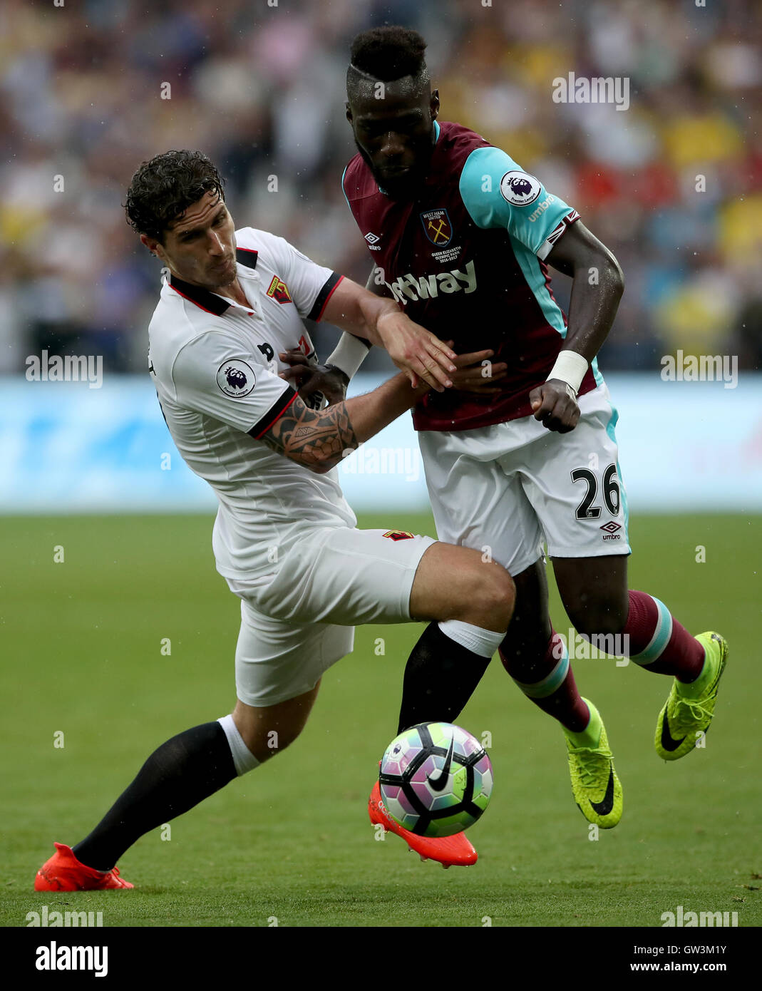 West Ham United's Arthur Masuaku (right) and Watford's Daryl Janmaat ...