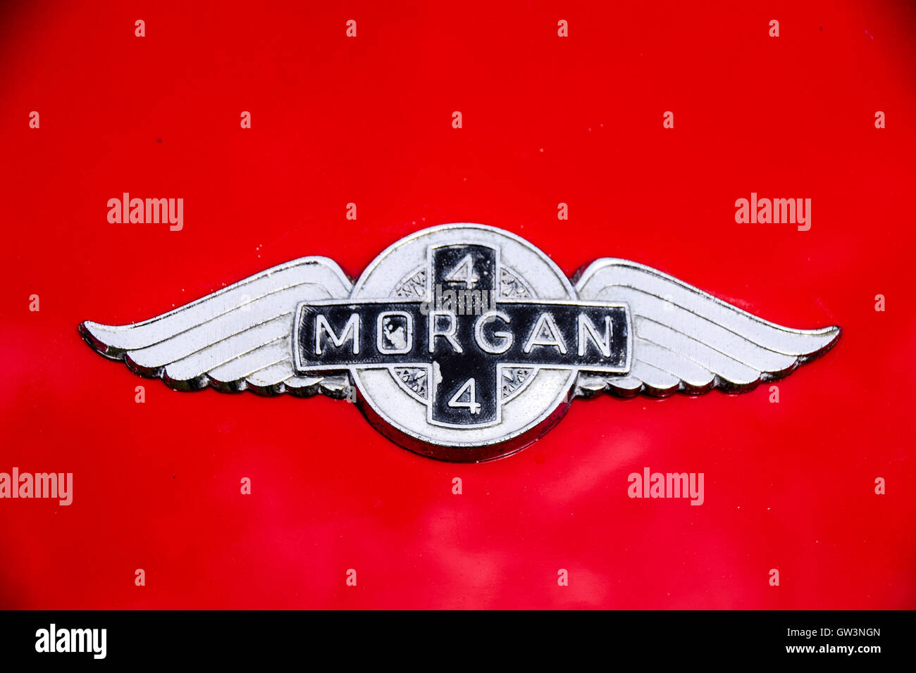 Morgan logo against red car bonnet Stock Photo - Alamy