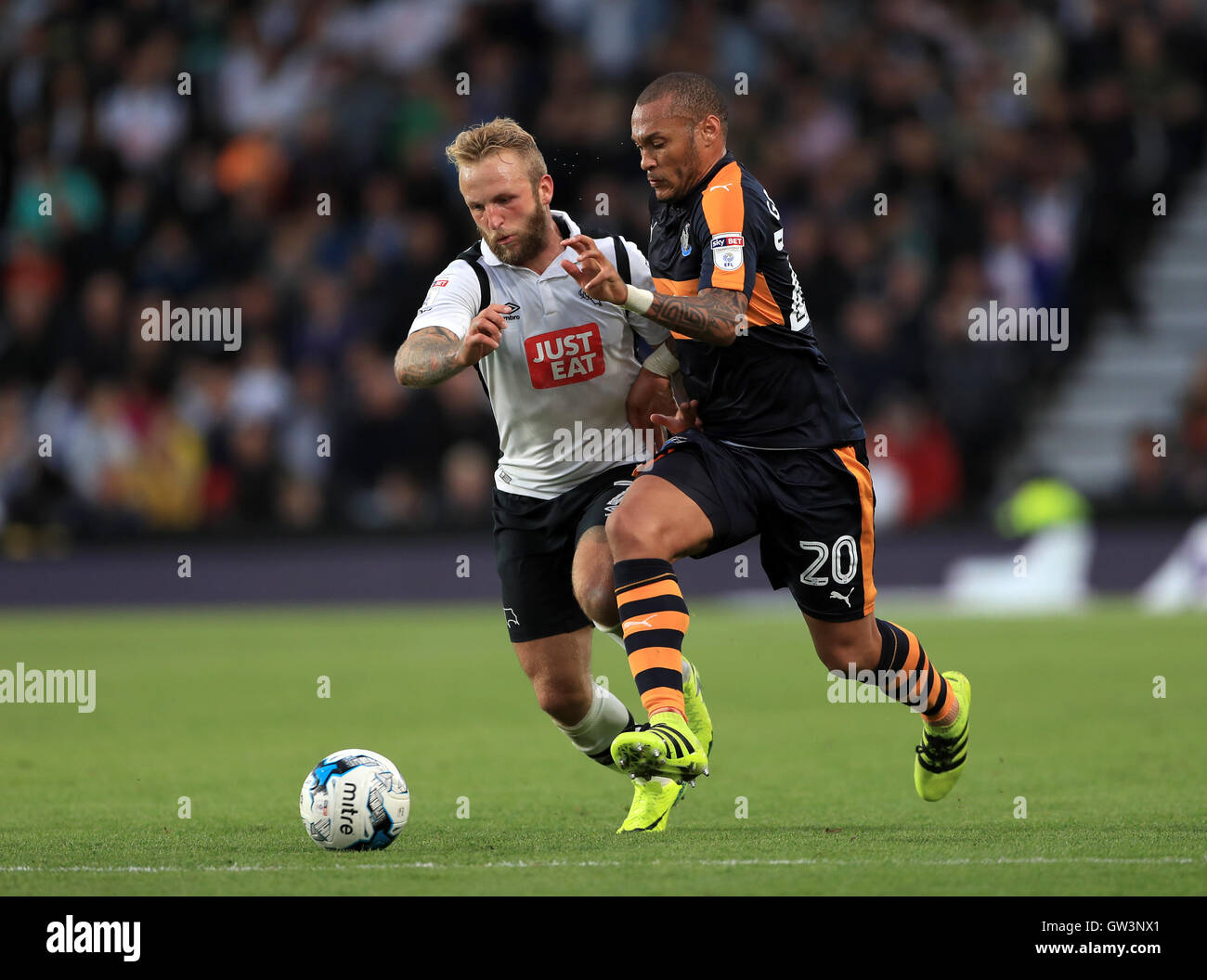 Derby County's Johnny Russell (left) and Newcastle United's Yoan ...
