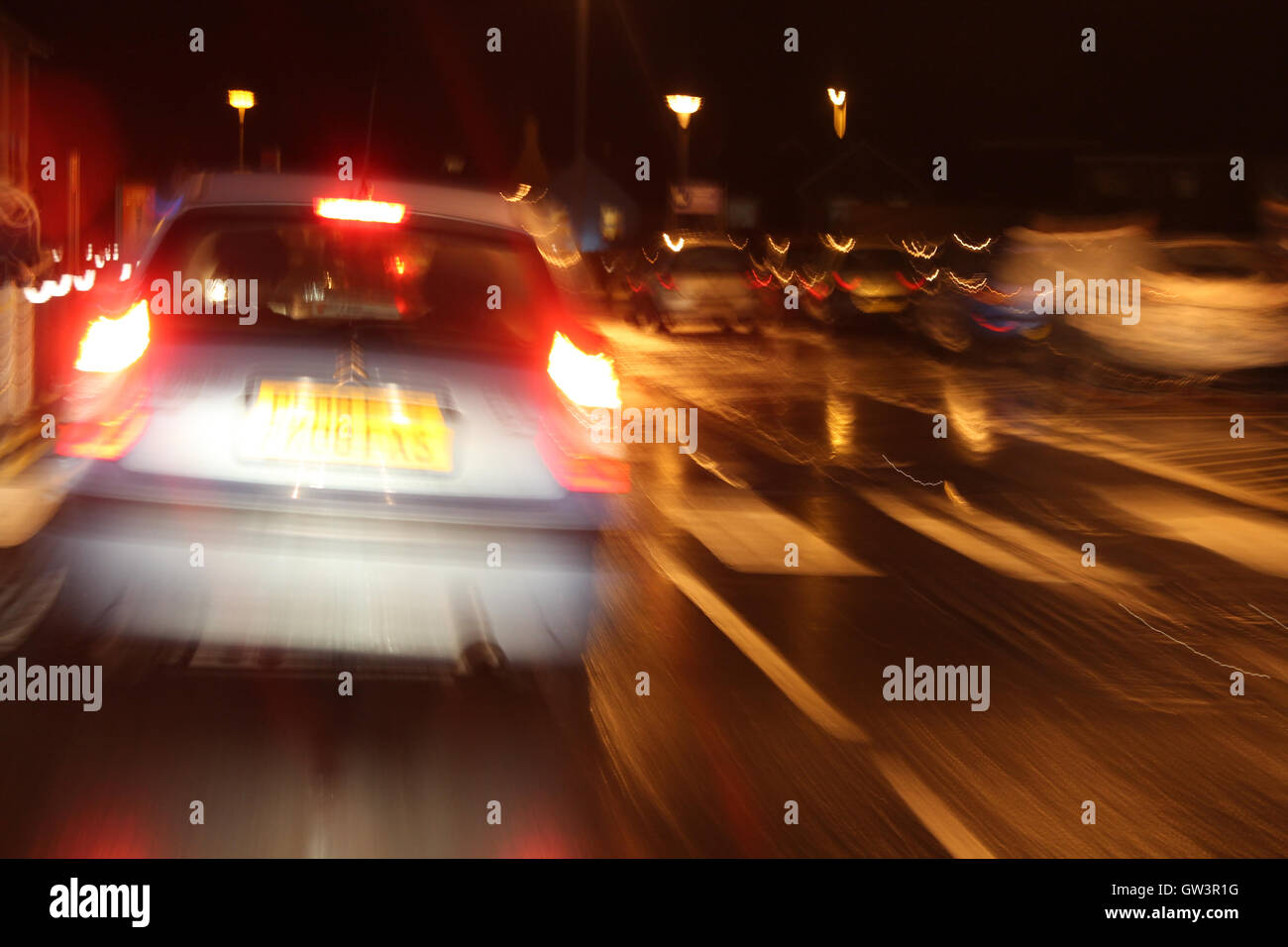 Car breaking suddenly in the wet Stock Photo - Alamy