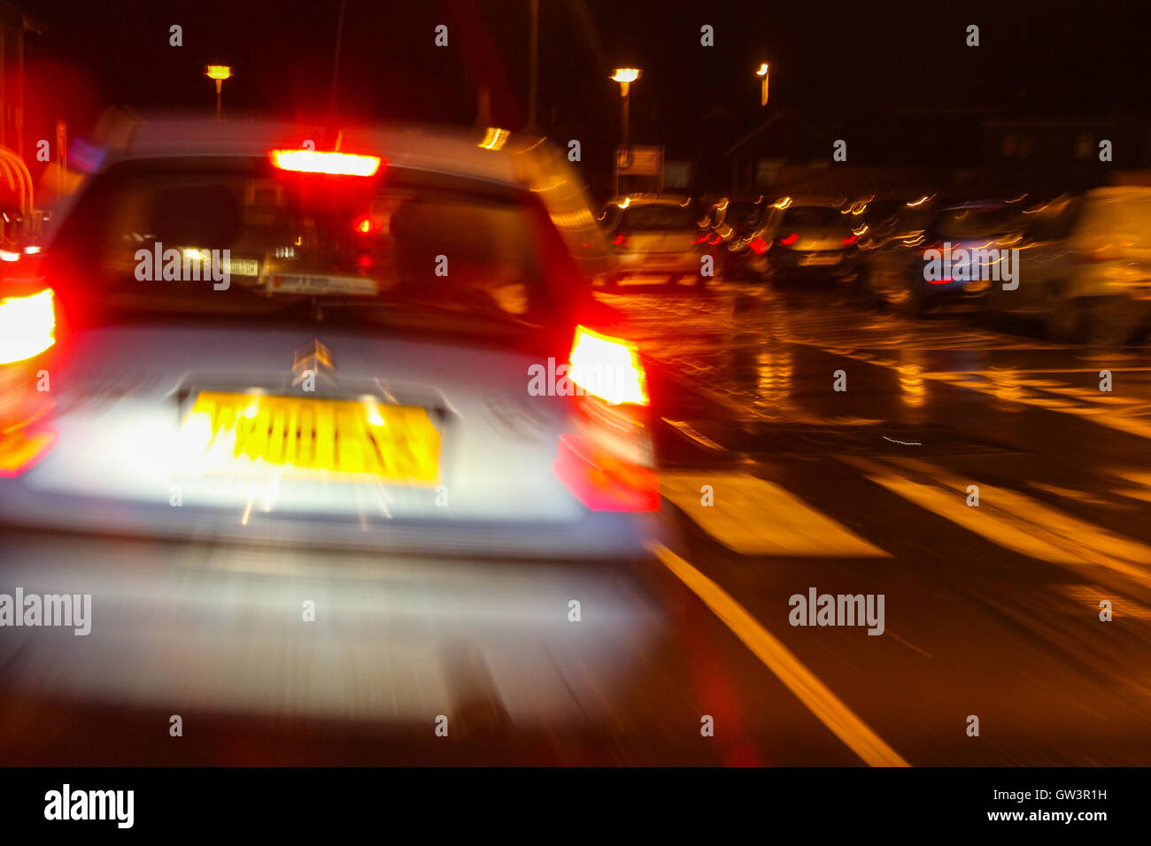 Car breaking suddenly in the wet Stock Photo - Alamy