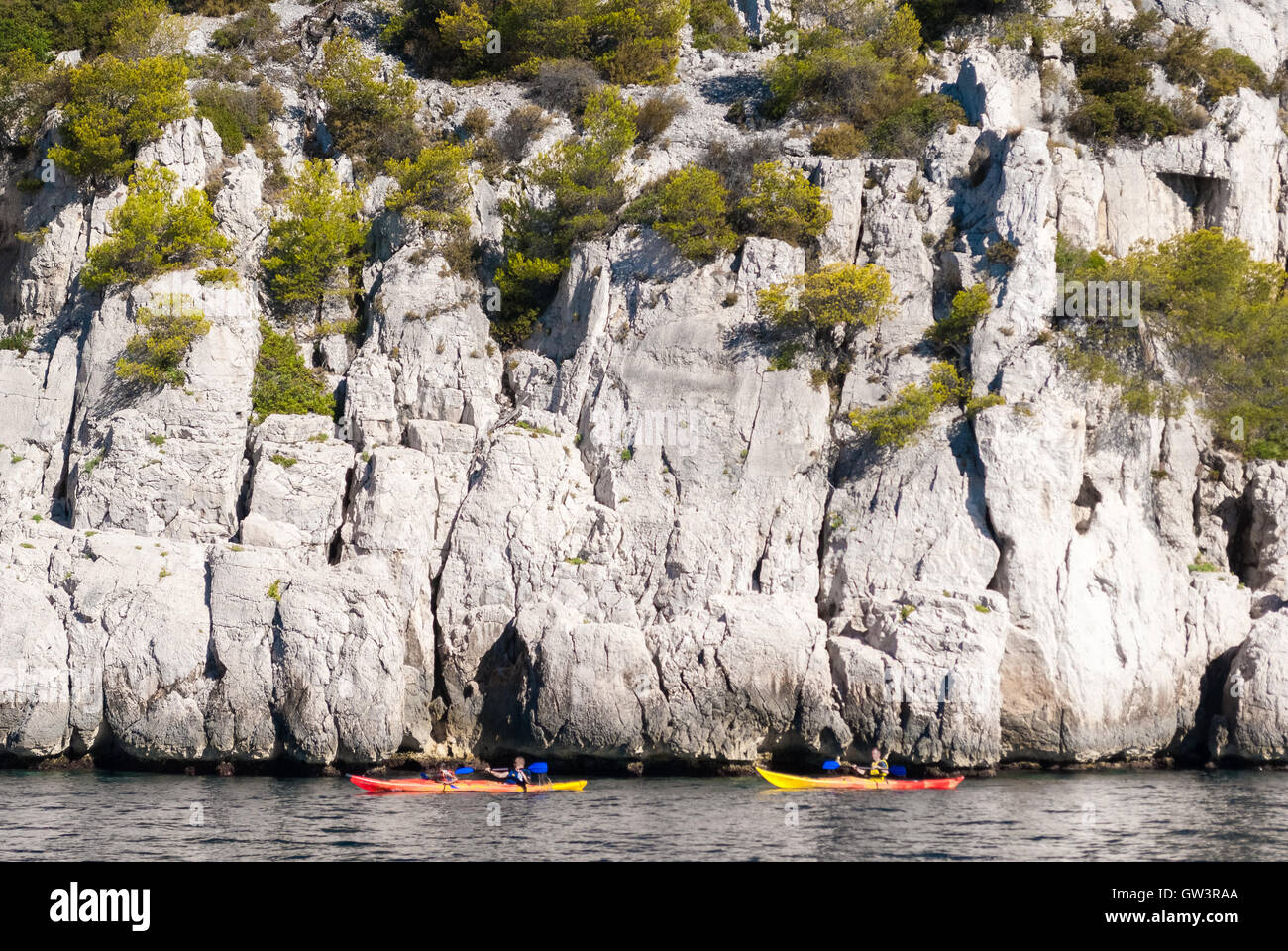 Two kayaks in front of the steep cliffs in the Calanques of Cassis ...