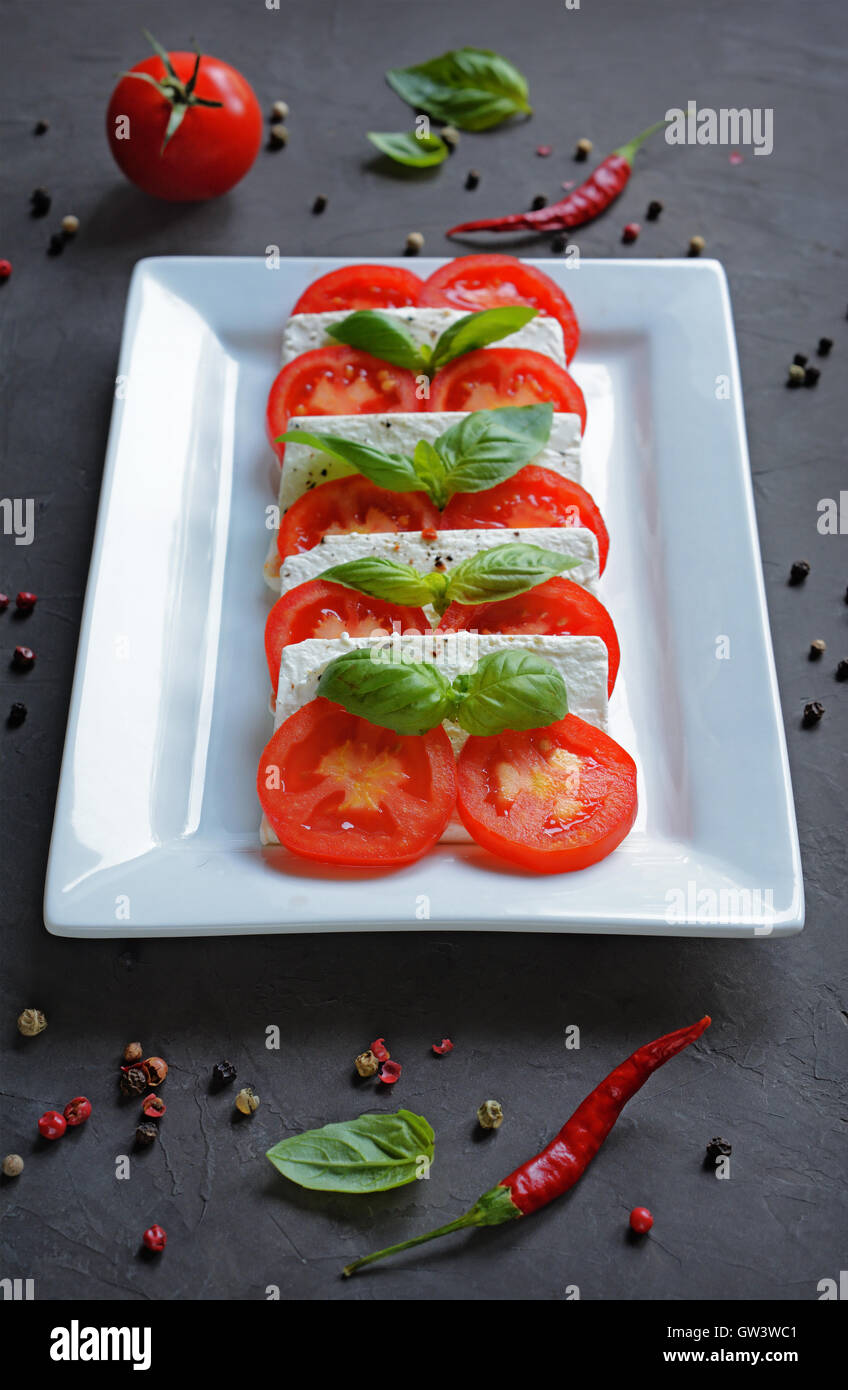 Caprese salad with ingredients in a rustic style Stock Photo - Alamy