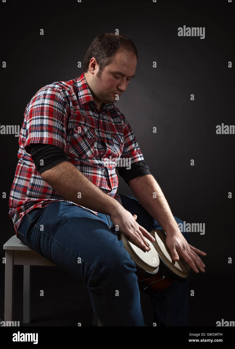 portrait of musician with bongo , studio shot Stock Photo - Alamy