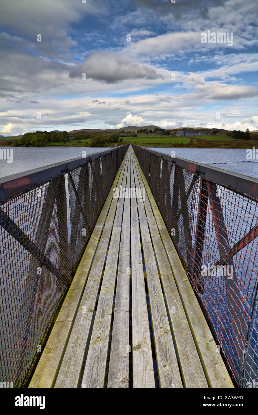 Long footbridge stretching into the distance across a wide lake Stock ...