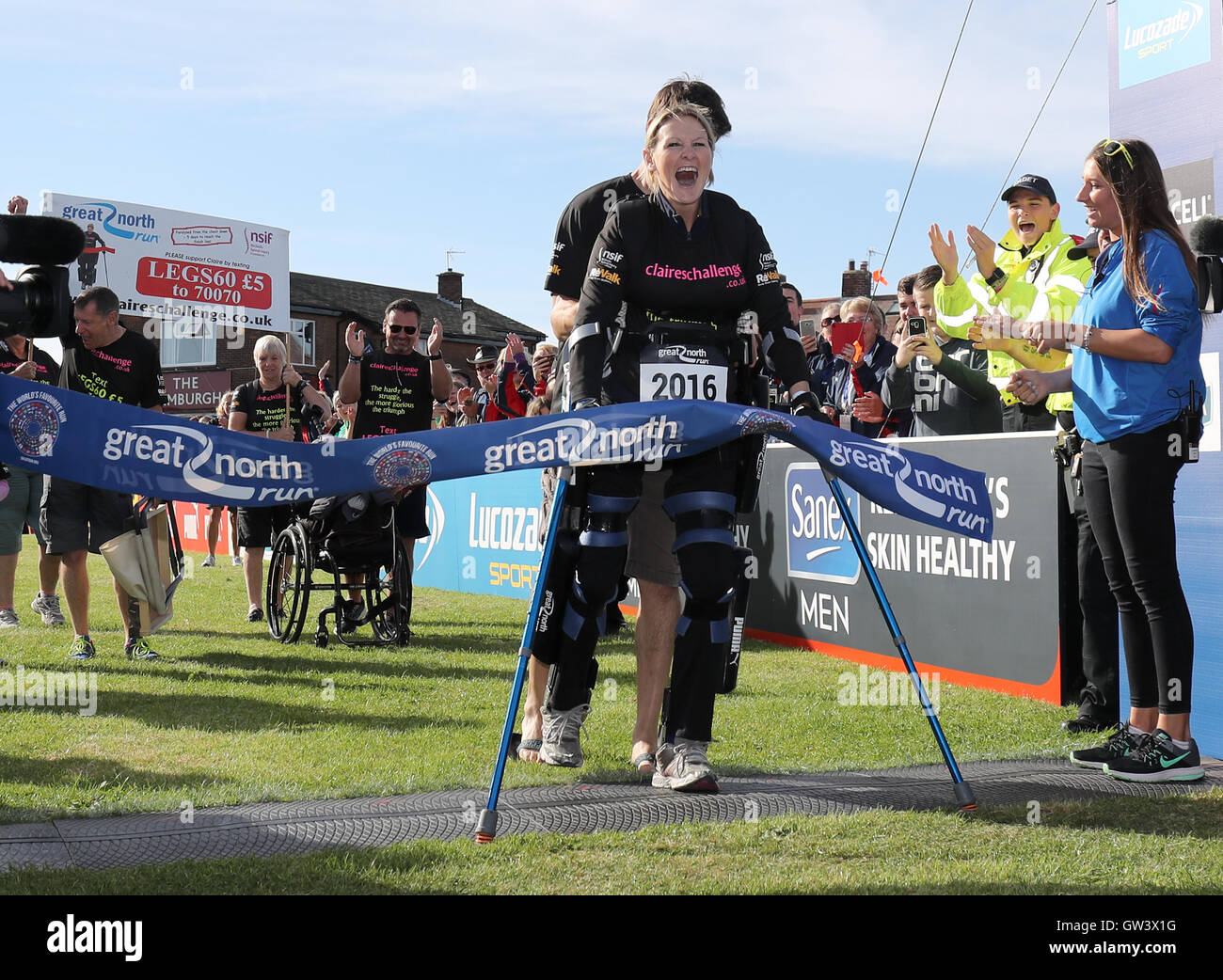 Claire Lomas crosses the finish line in her robotic suit during the ...