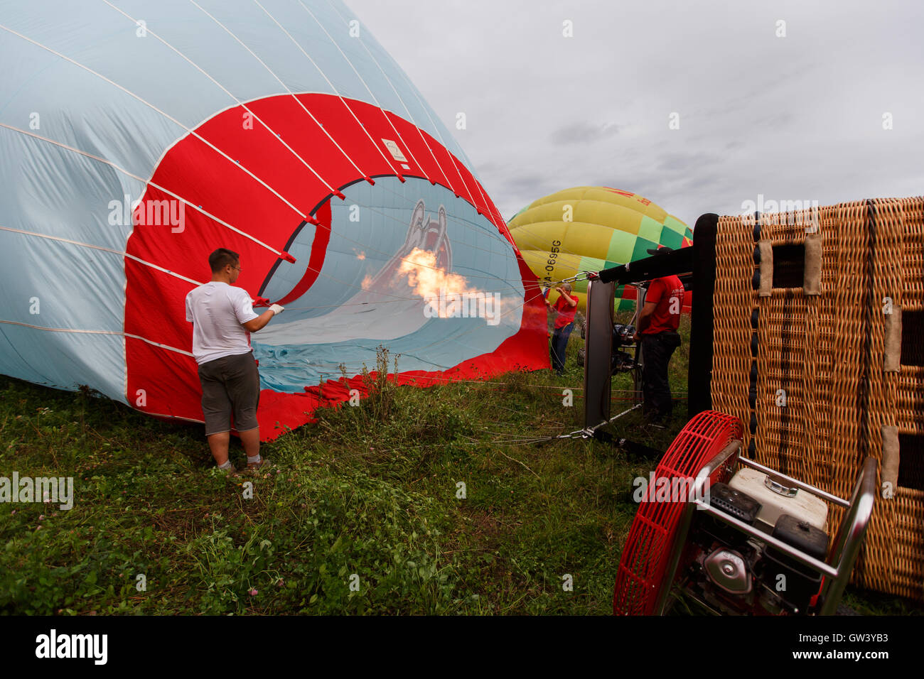 Hot air balloon with flames Stock Photo - Alamy