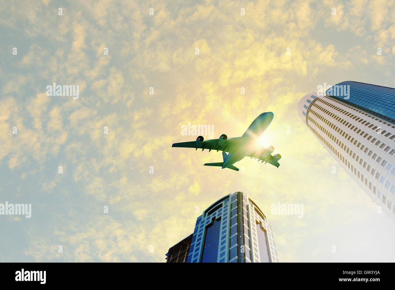 Airplane above city Stock Photo - Alamy