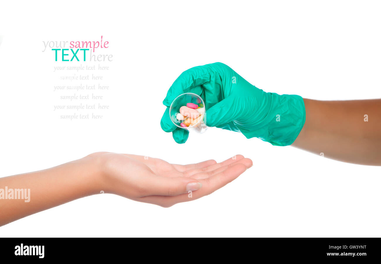 doctor hands giving capsule and pill, on white background Stock Photo ...
