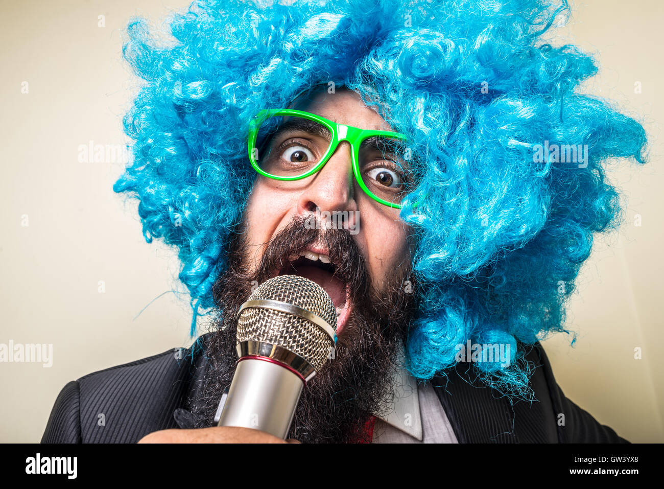 crazy funny bearded man with blue wig Stock Photo - Alamy
