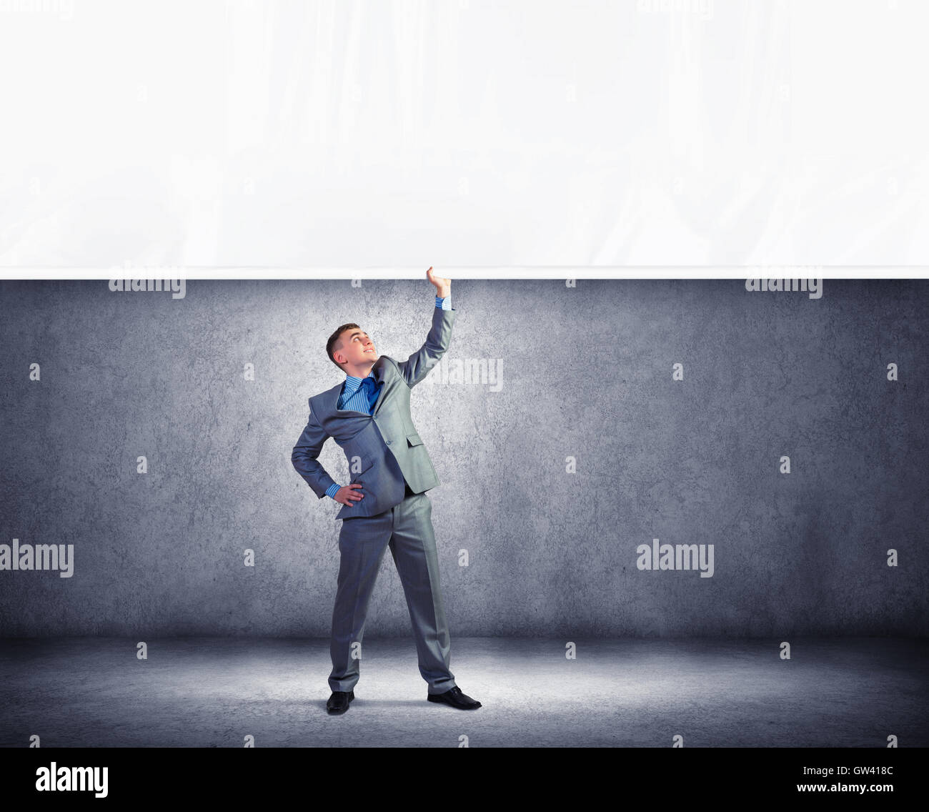Young man pulling banner Stock Photo - Alamy