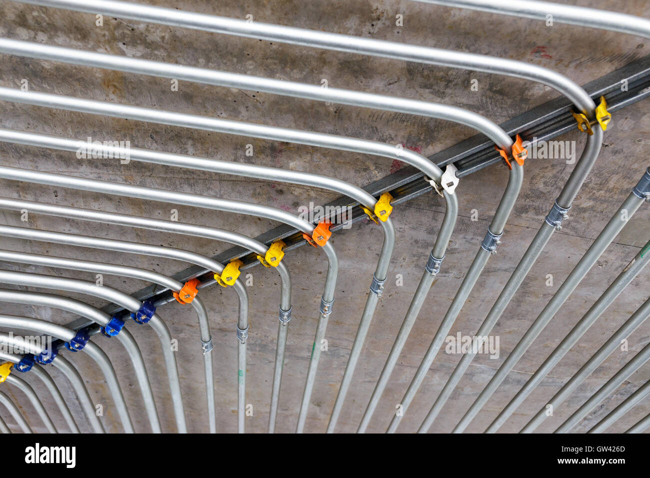 Series of parallel old pipes on wall Stock Photo - Alamy