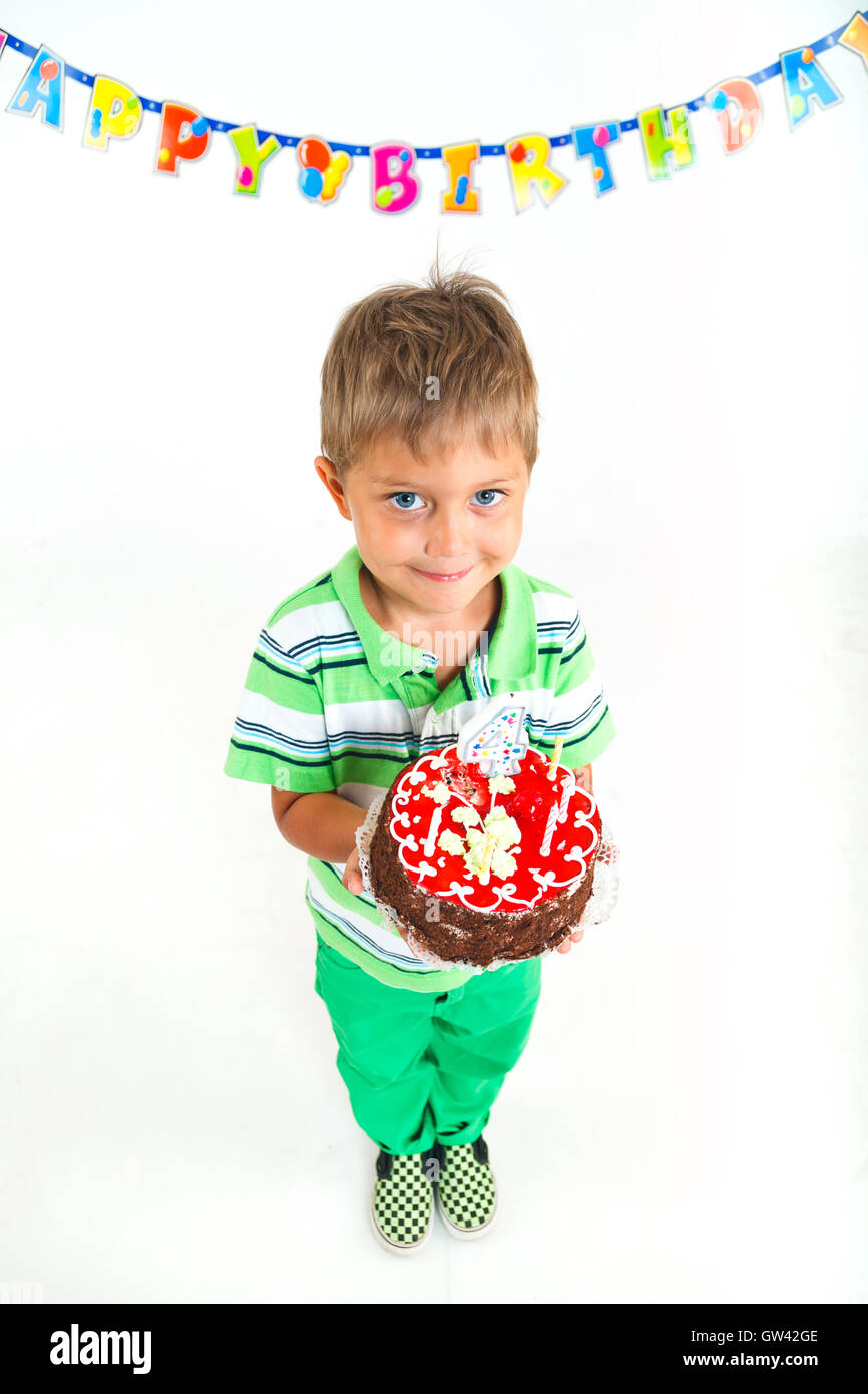 Boy with birthday cake Stock Photo - Alamy