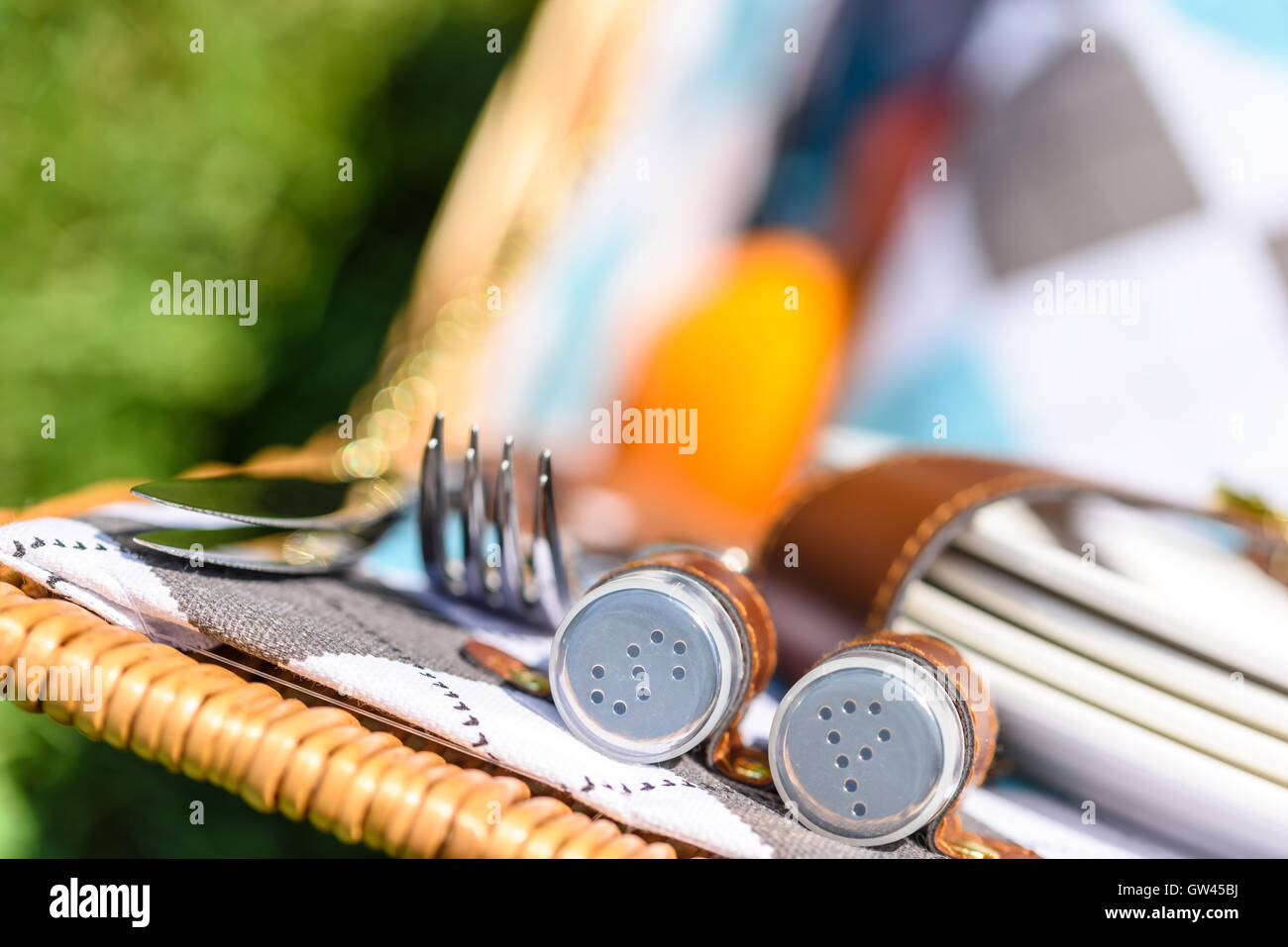 Salt And Pepper With Cutlery In Picnic Basket Stock Photo - Alamy