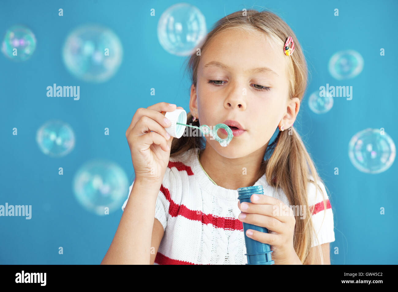 Child blowing soap bubbles Stock Photo - Alamy Child blowing soap bubbles Stock Photo - Alamy