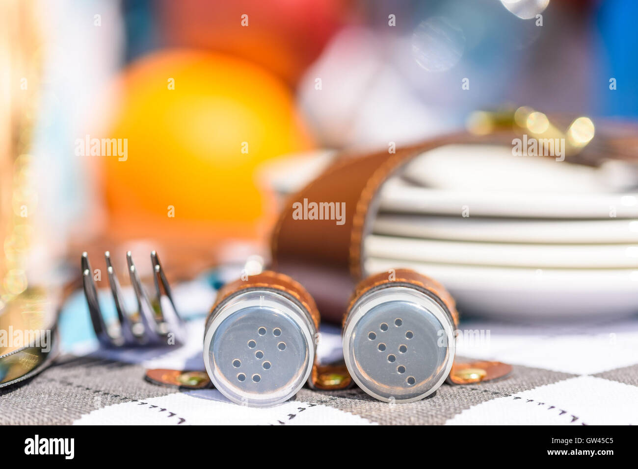 Salt And Pepper With Cutlery In Picnic Basket Stock Photo - Alamy