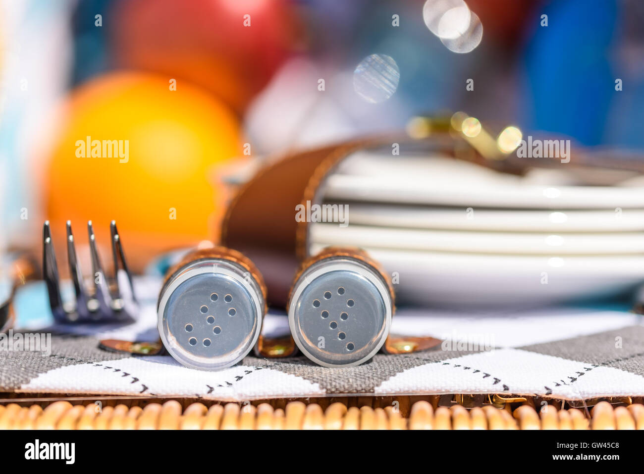 Salt And Pepper With Cutlery In Picnic Basket Stock Photo - Alamy