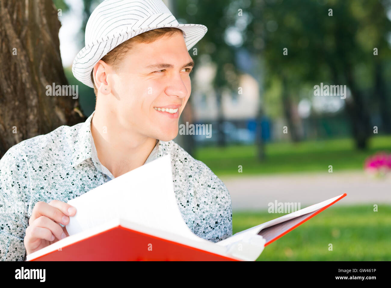 young man reading a book Stock Photo - Alamy