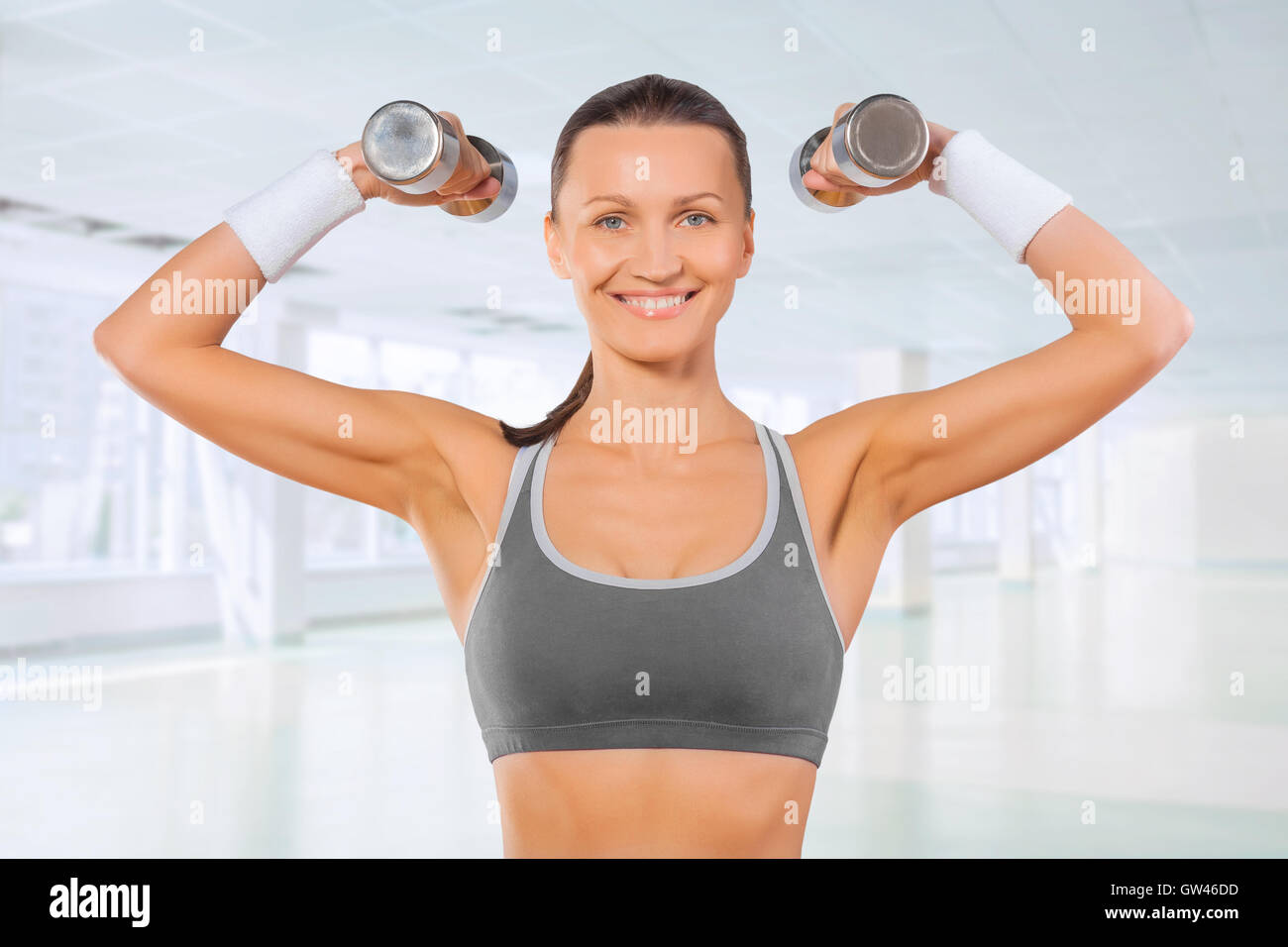 sports woman with small dumbbells Stock Photo - Alamy