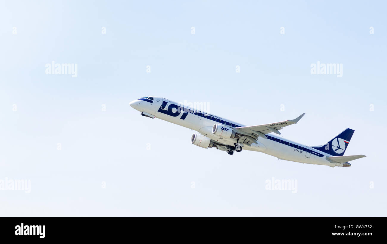 Airplane Embraer in the sky Stock Photo - Alamy
