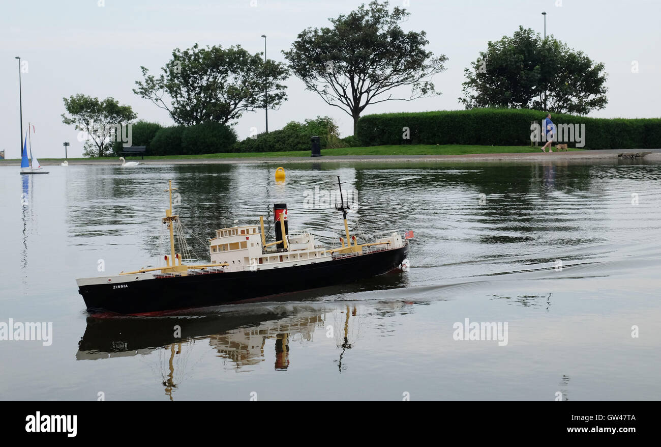 A model boat sails in the boating lake at Tynemouth Model Boat Club in ...