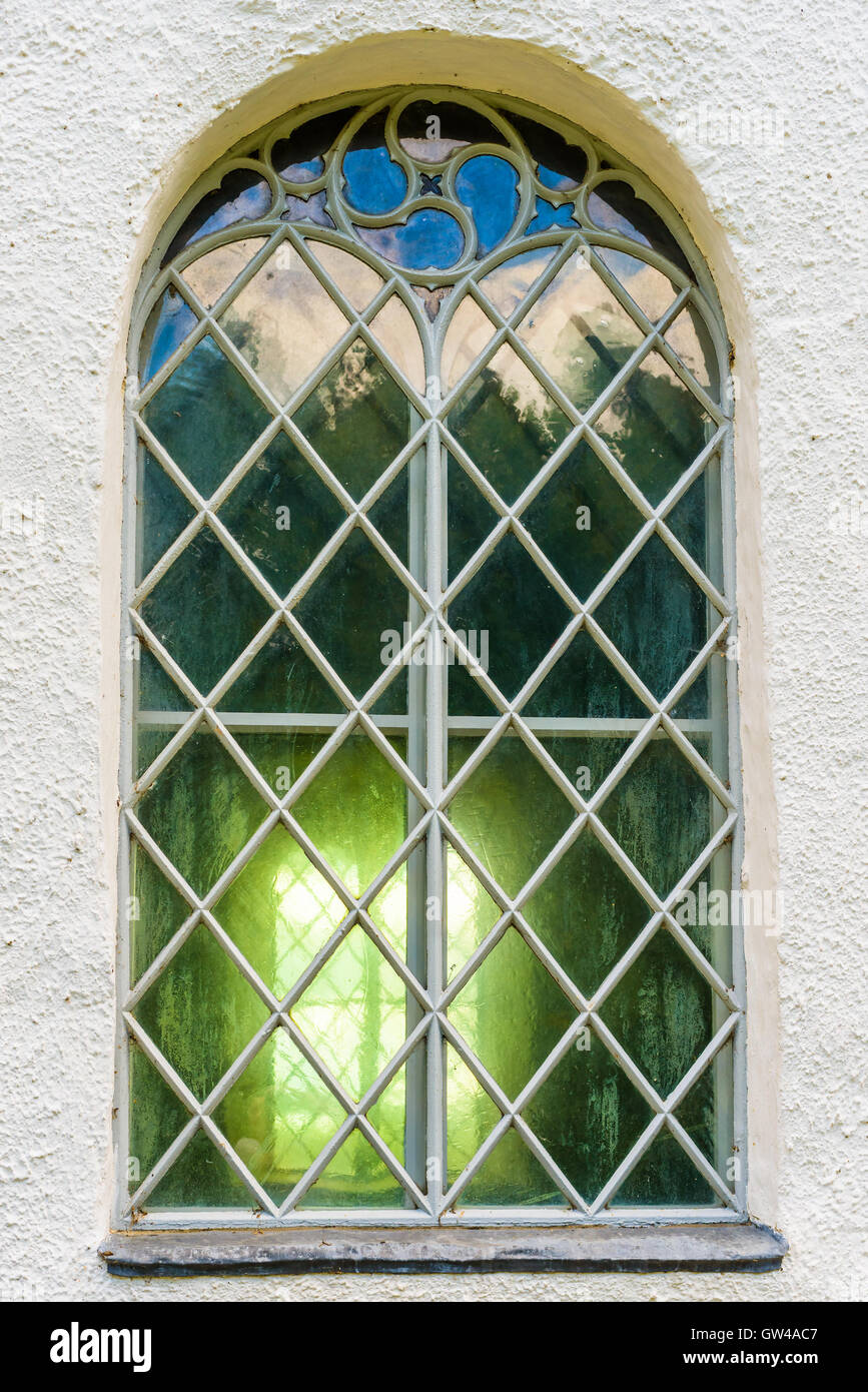 Church window showing another window on the opposite side of the ...