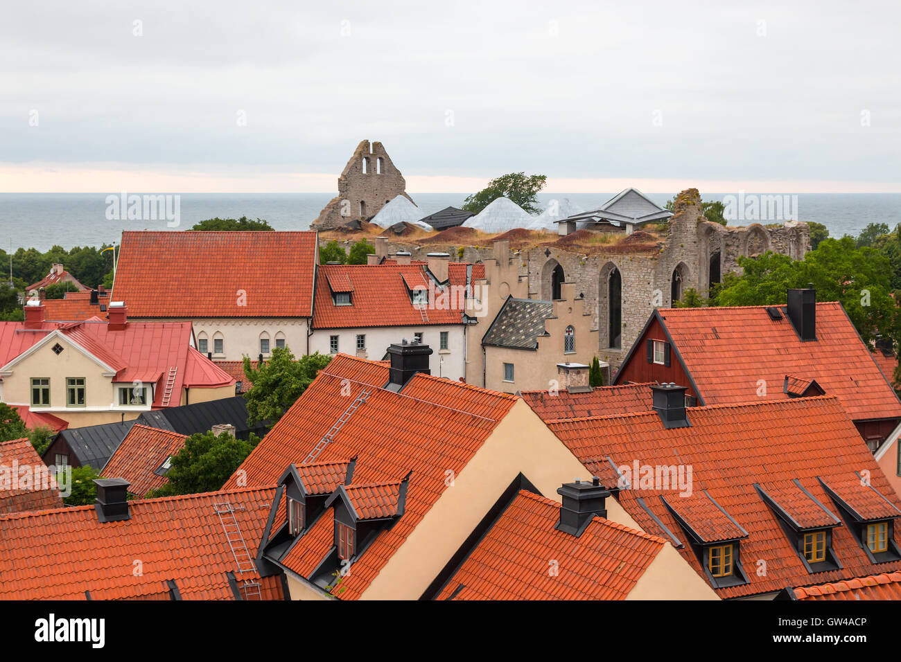 Rooftops and ruins of a medieval church Stock Photo - Alamy