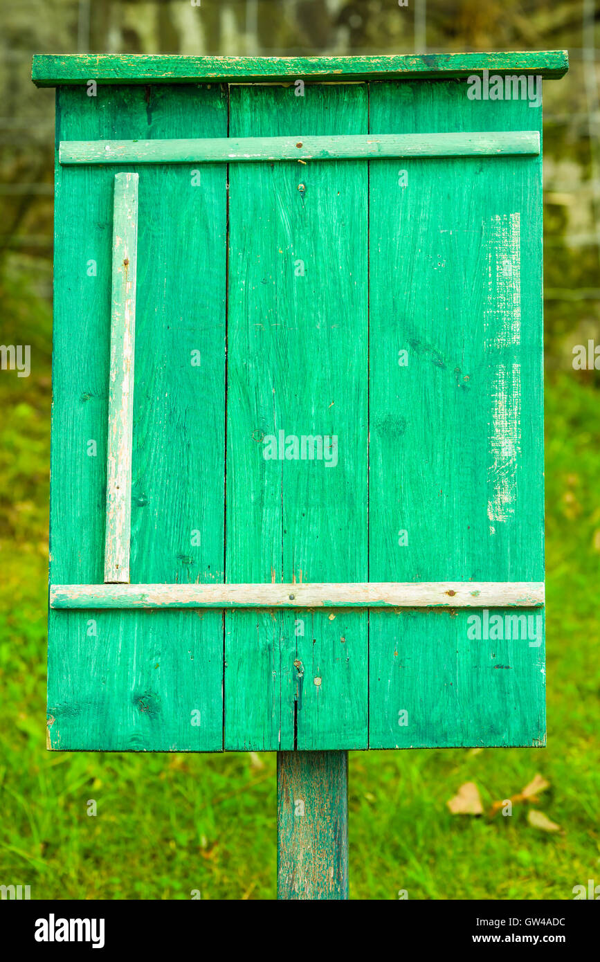 Green and empty wooden noticeboard in nature. Copy space Stock Photo ...