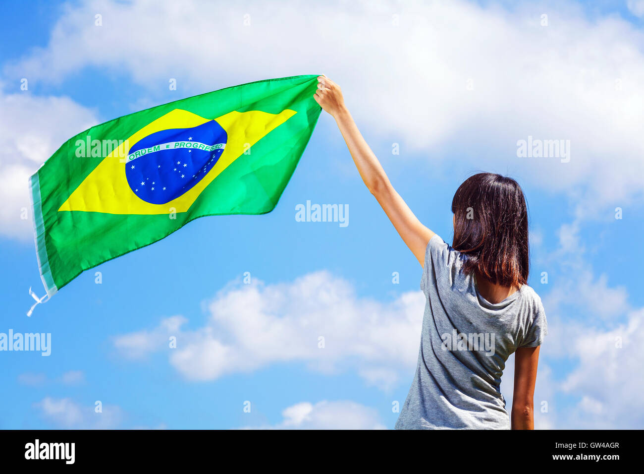 Woman holding a brazil flag Stock Photo - Alamy