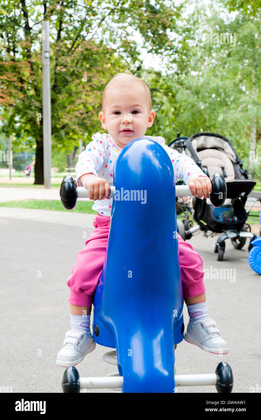 Baby in park Stock Photo - Alamy
