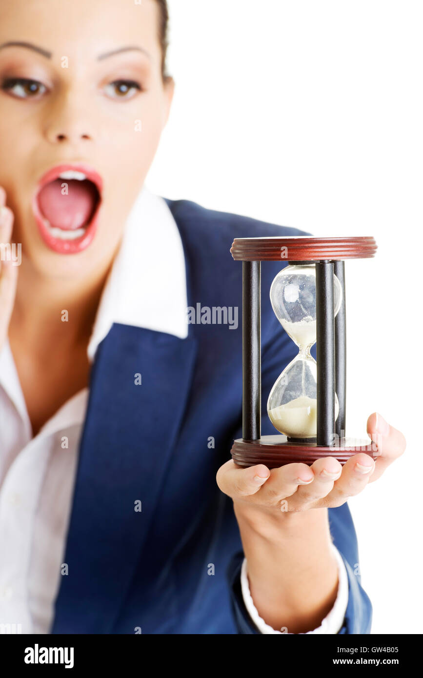 Young business woman with hourglass - time concept Stock Photo - Alamy