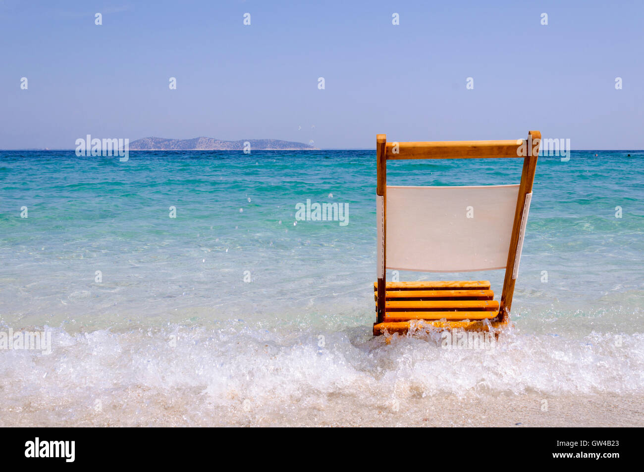 Chair on the beach Stock Photo - Alamy