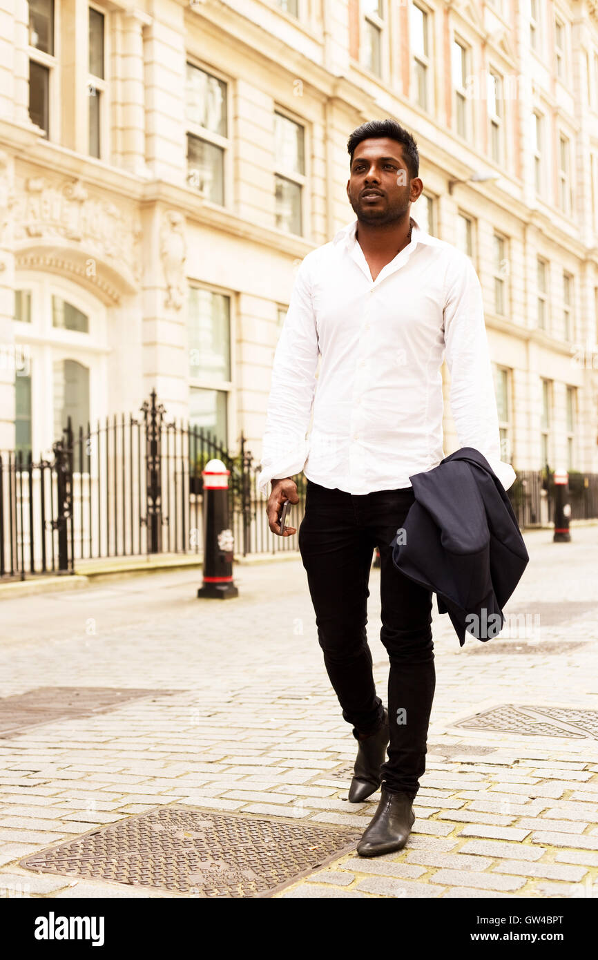Indian man walking hi-res stock photography and images - Alamy