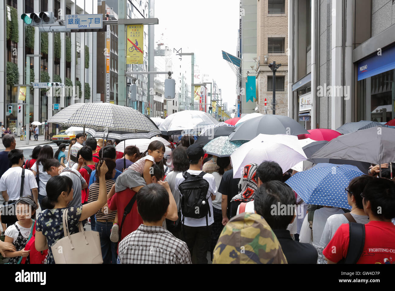 Hiroshima Carp baseball team fans line up along to the main street of ...