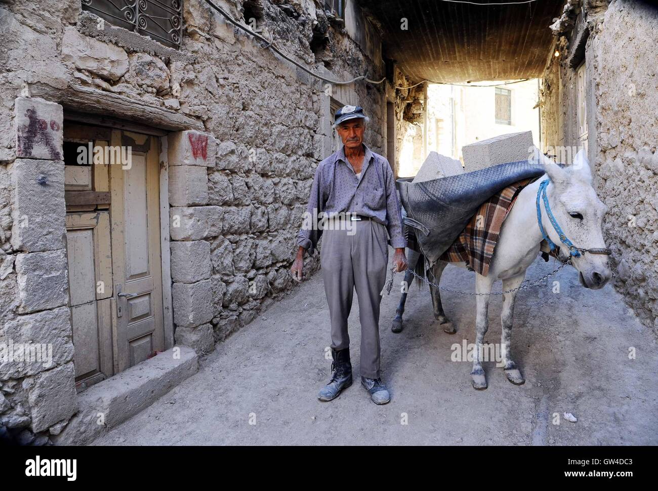 Damascus, Syria's capital Damascus. 10th Sep, 2016. A Syrian man stands ...