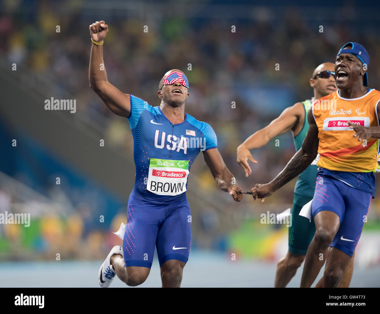 USA's David Brown and guide Jerome Avery react to winning the men's 100 ...