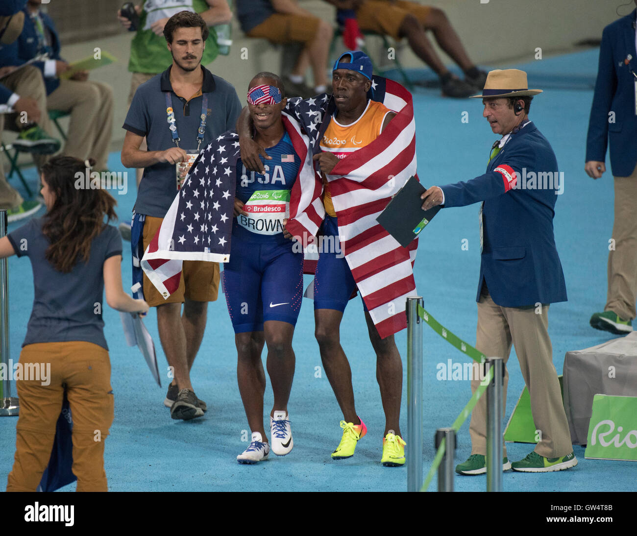 USA's David Brown, with guide Jerome Avery, celebrates after winning ...