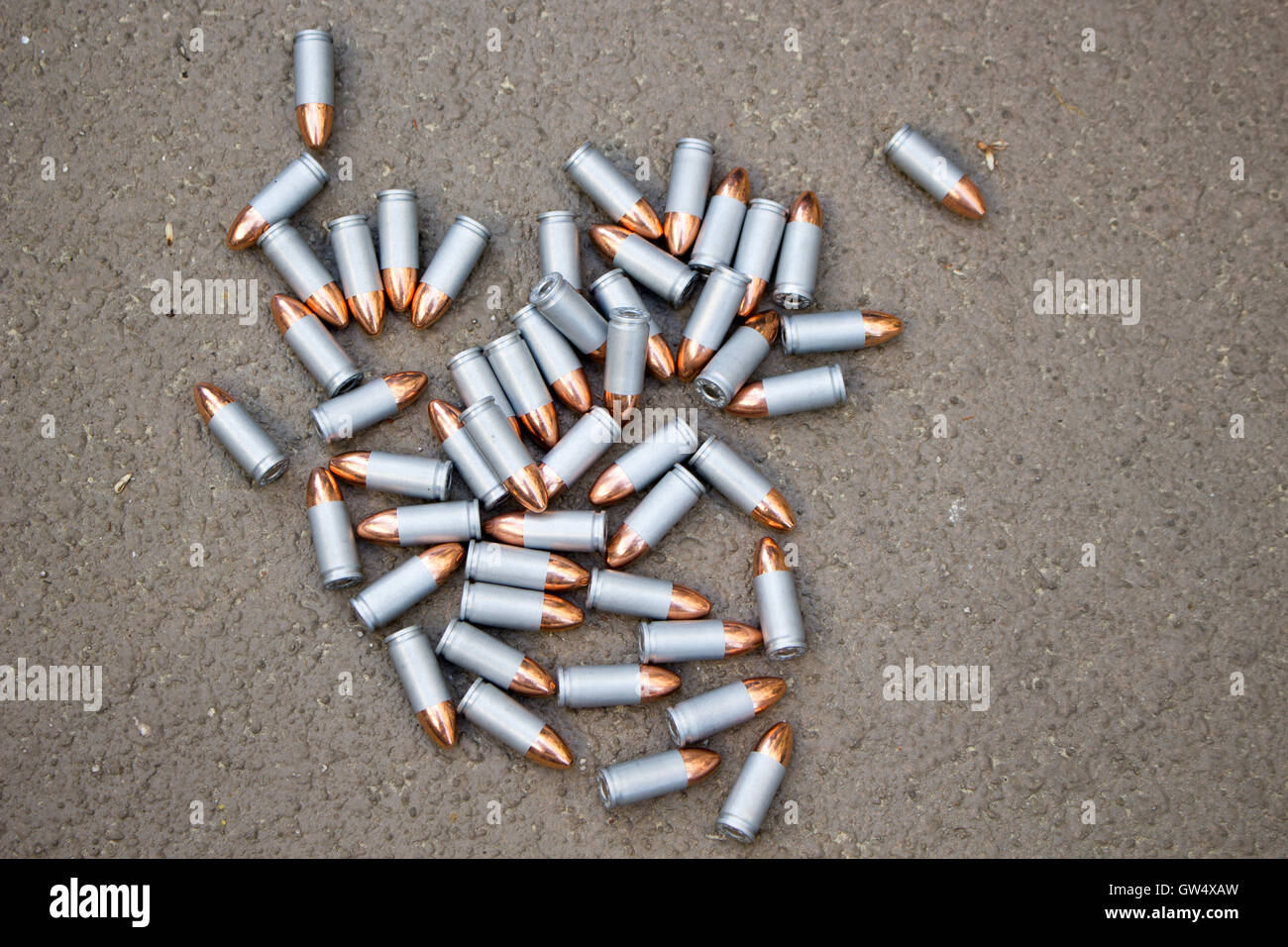 9mm Ammunition on Concrete Surface Stock Photo - Alamy