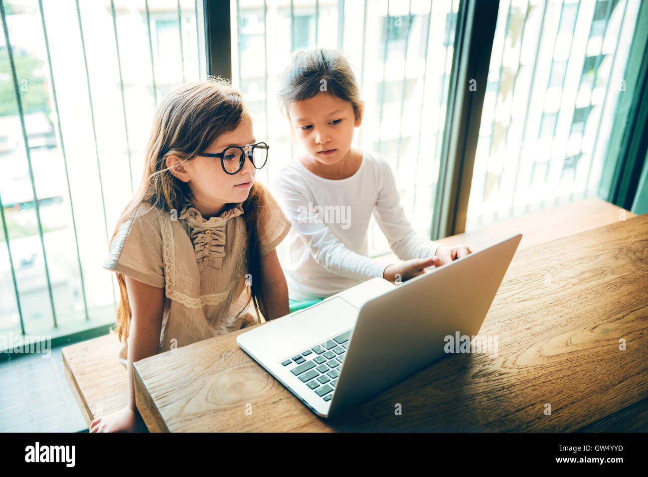 Little Girls Using Computer Concept Stock Photo - Alamy