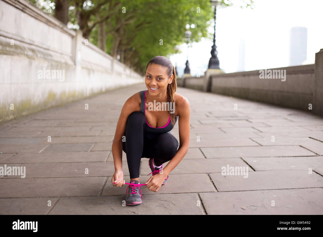 Fitness woman preparing for her run Stock Photo - Alamy