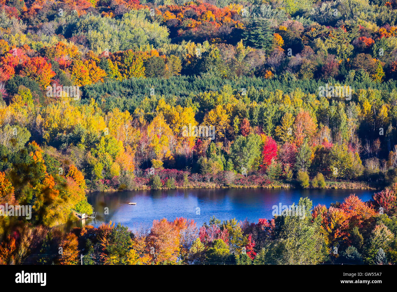 Blue lake surrounded by fall foliage in Wisconsin Stock Photo - Alamy