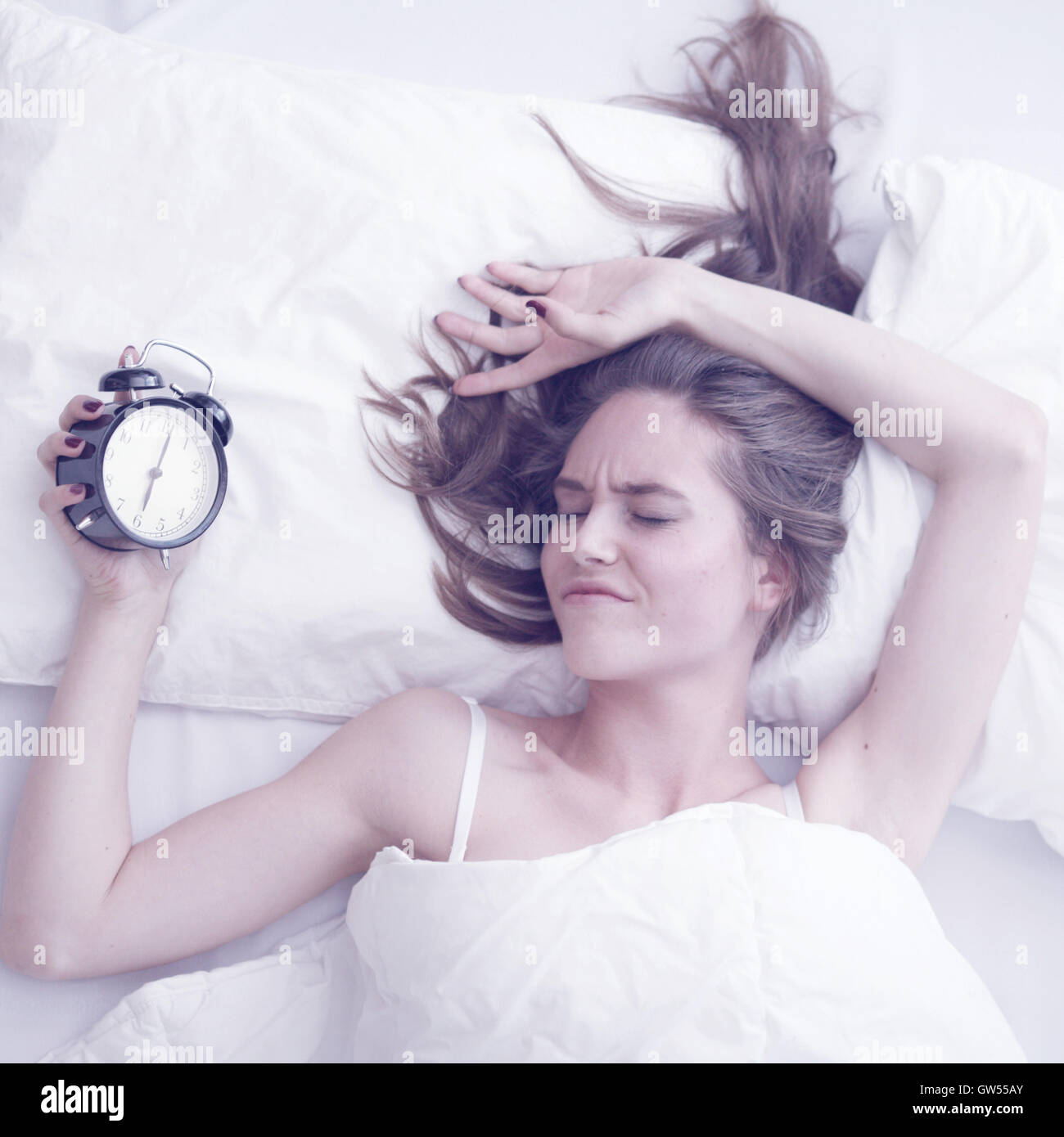 Woman alarm clock hi-res stock photography and images - Alamy