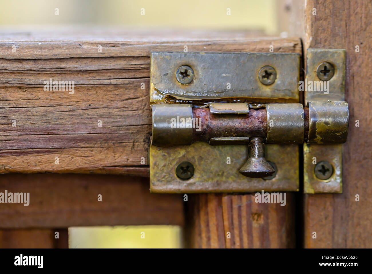 old rusty bolt lock on wood gate Stock Photo - Alamy