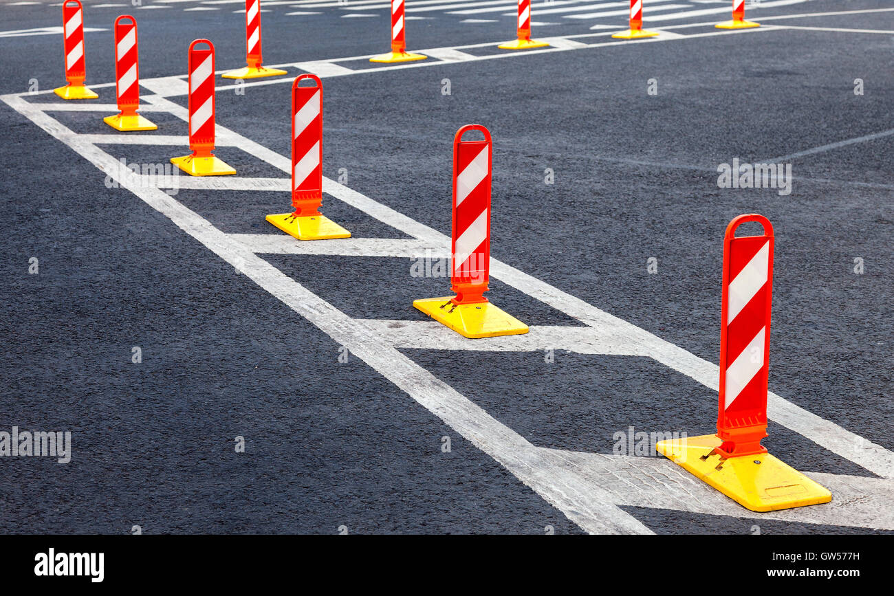 Traffic safety. Traffic markings on a gray asphalt. Red and white ...