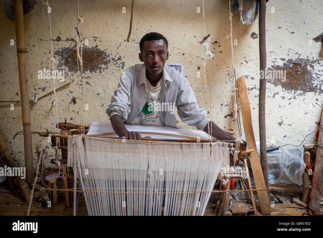 Young male weaver with his loom in a Dorze tribal village in the Omo ...